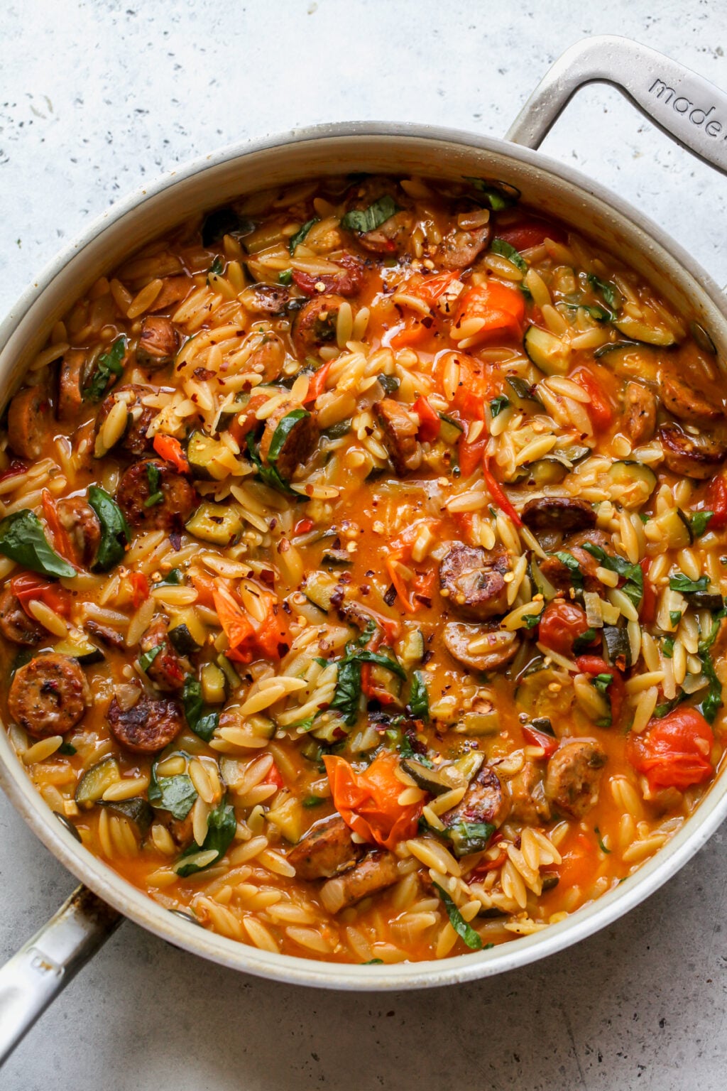 One Pan Chicken Sausage Orzo with Burst Tomatoes - Dishing Out Health